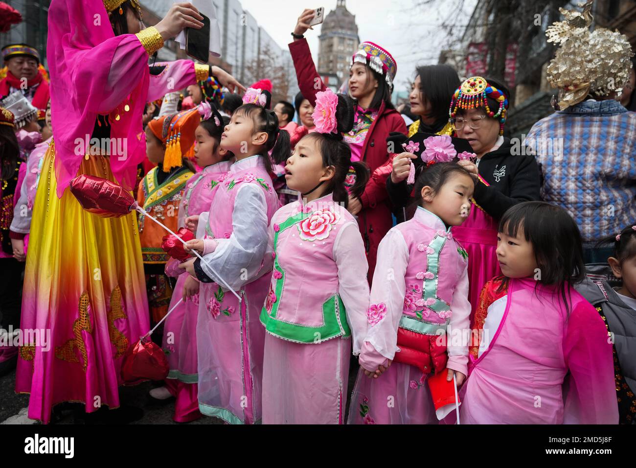 Young girls wait to participate in the Lunar New Year parade, in ...
