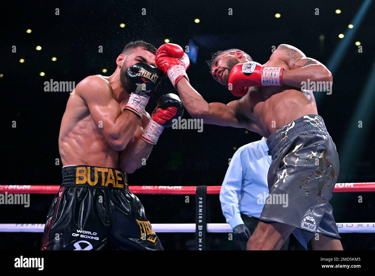 Jamal James, right, punches Radzhab Butaev, of Russia, during a WBA ...