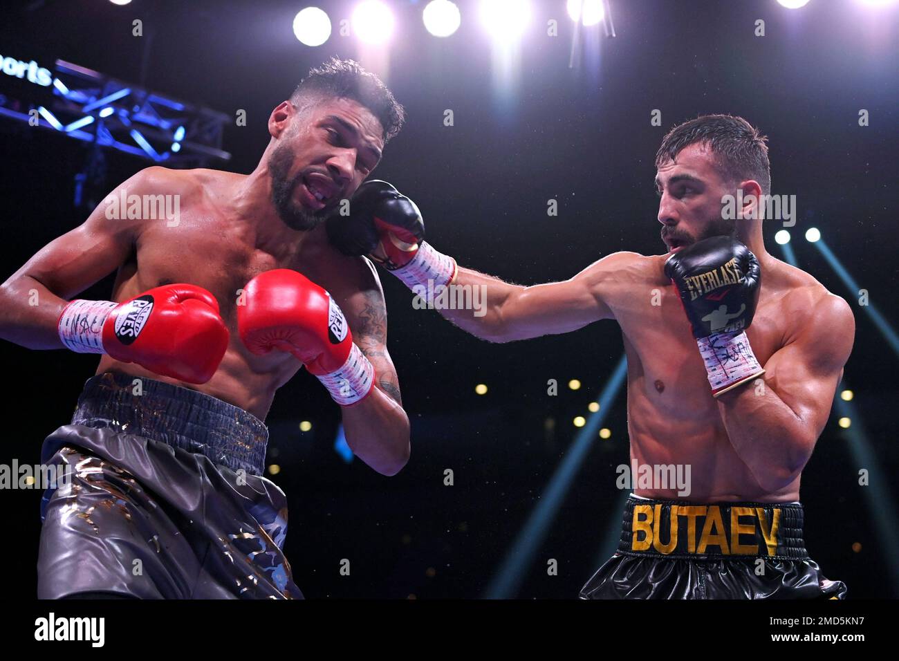 Radzhab Butaev, right, of Russia, punches Jamal James during a WBA ...