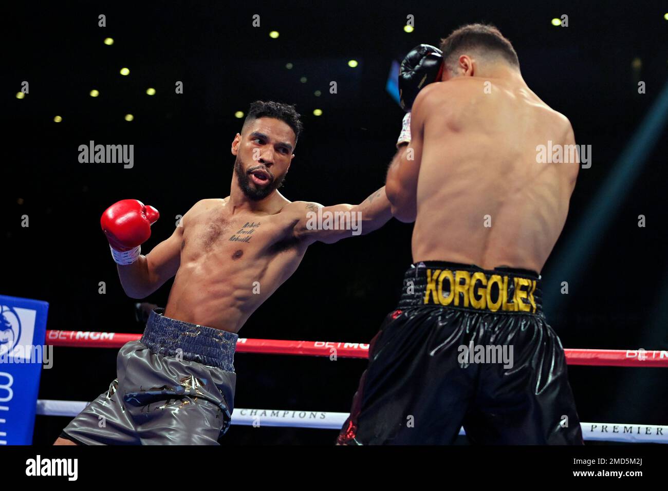 Jamal James, left, punches Radzhab Butaev, of Russia, during a WBA ...