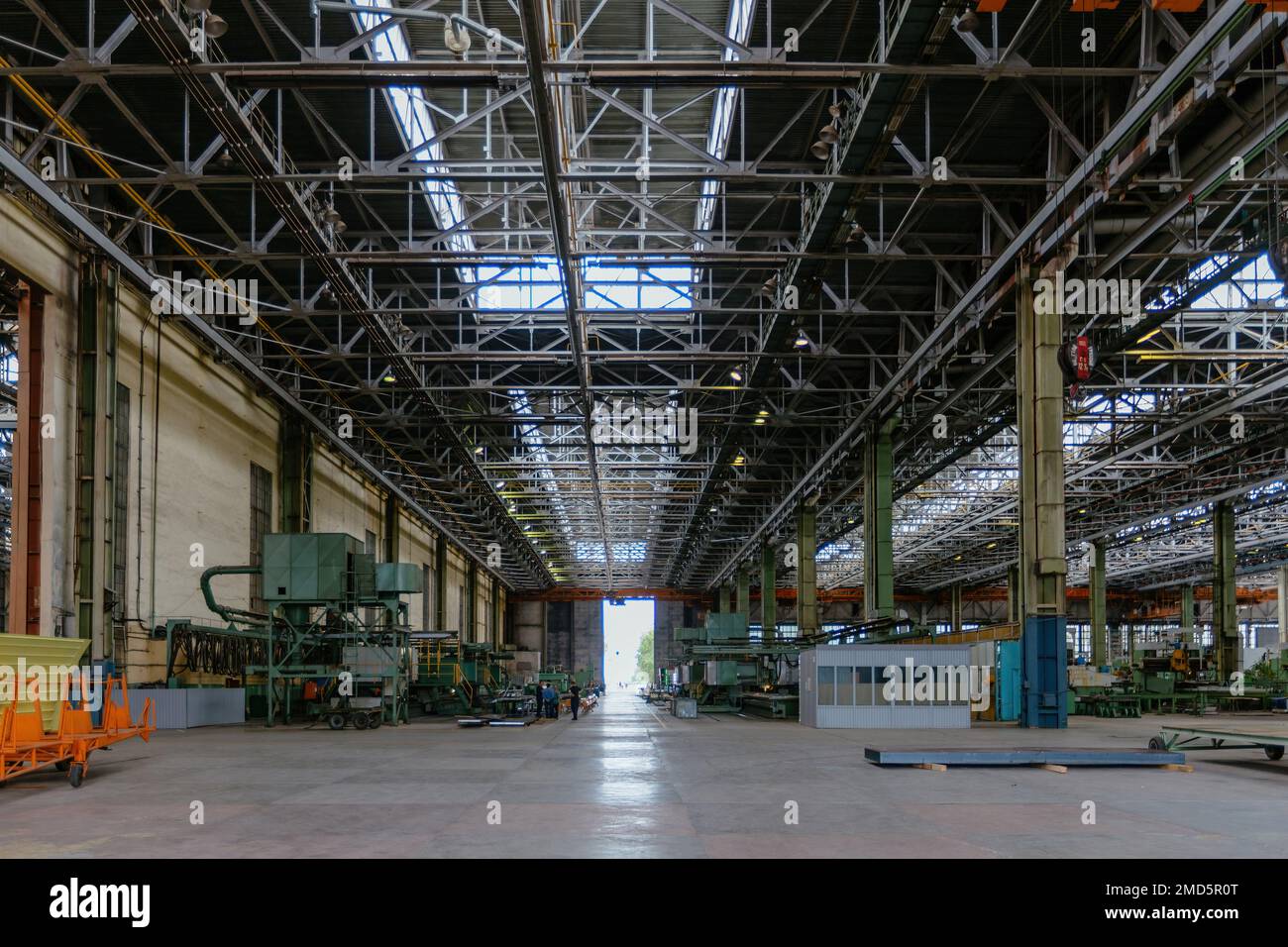 Heavy mechanical engineering factory production line. Interior of large ...