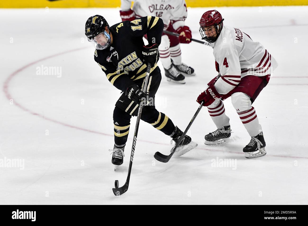 Western Michigan forward Jason Polin, left, controls the puck in front ...