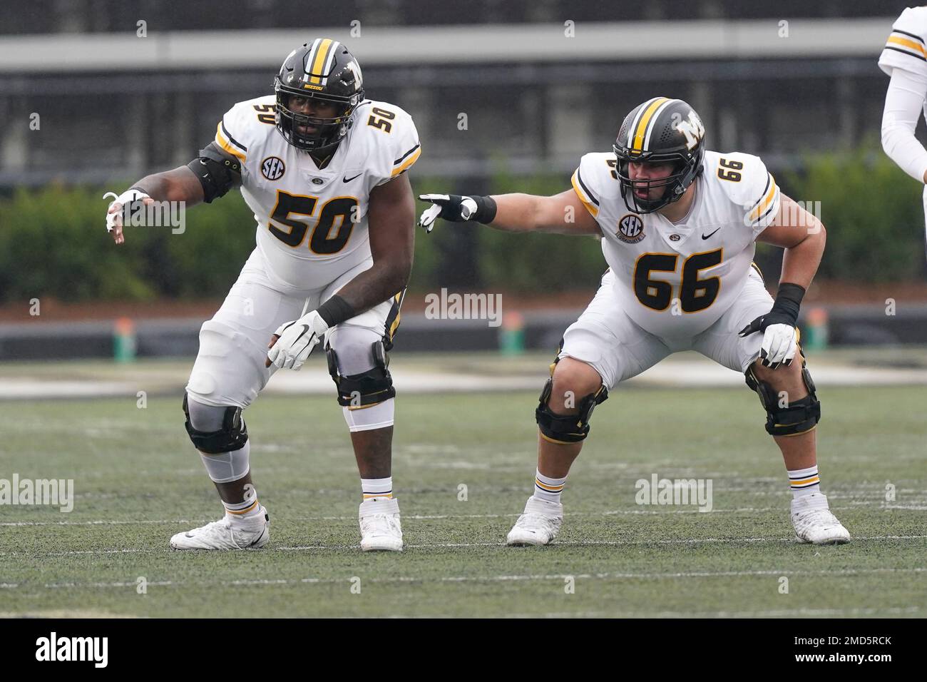 Missouri offensive linemen Hyrin White (50) and Connor Wood (66) plays ...