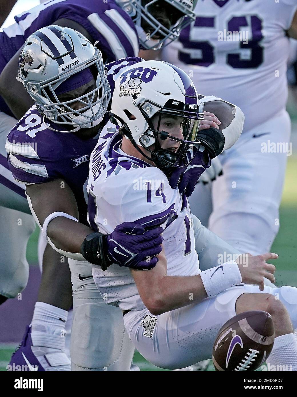 TCU quarterback Chandler Morris (14) fumbles the ball after being ...