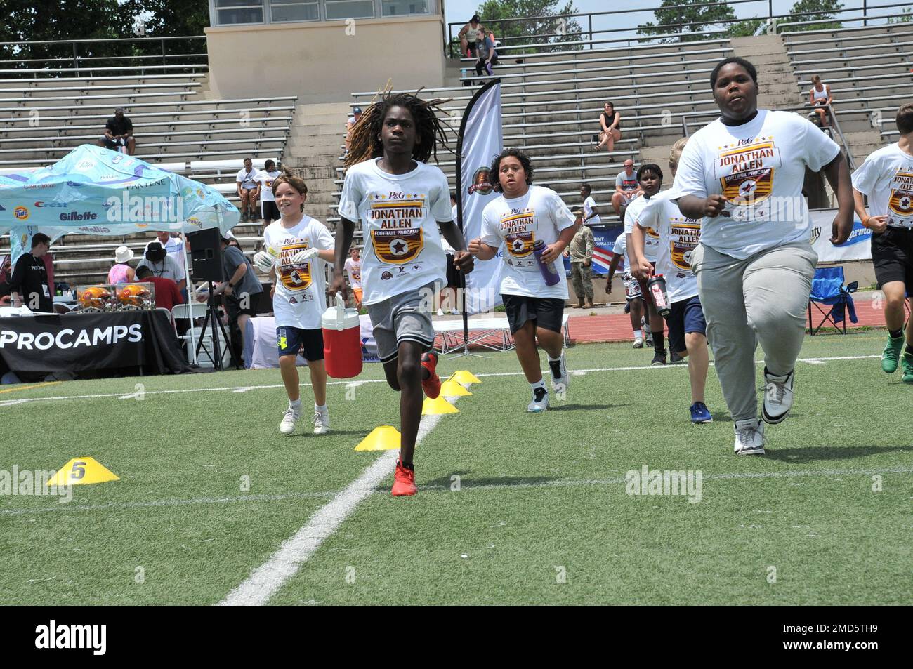 NFL Football ProCamp attendees run across the field at Williams Stadium ...