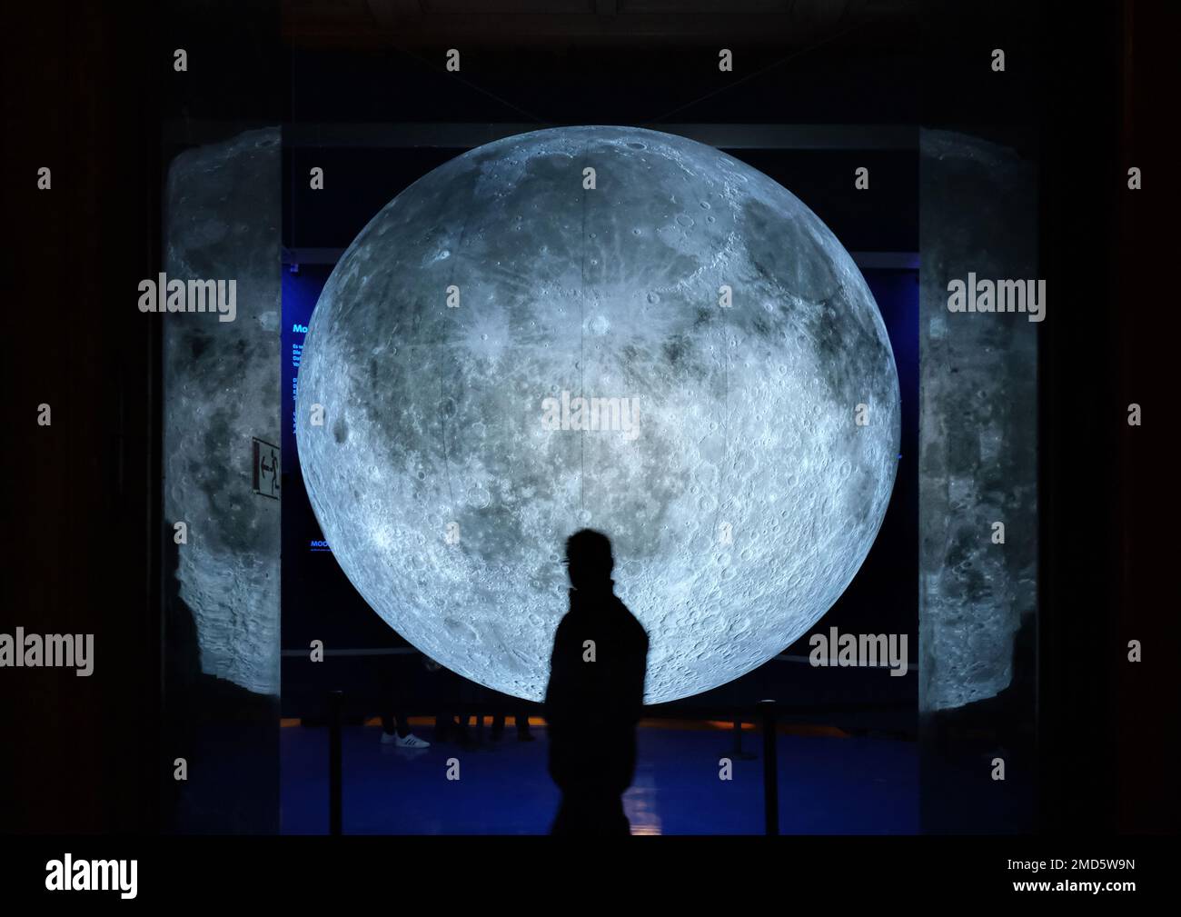 Vienna, Austria, Dec. 2022: Moon model and a man silhouette in the ...