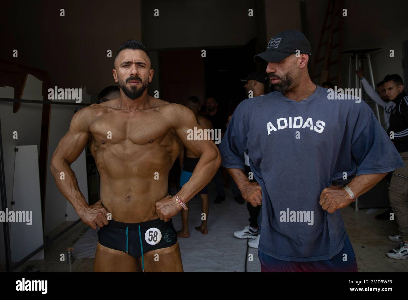 A personal trainer prepares his bodybuilder for the competitions ...