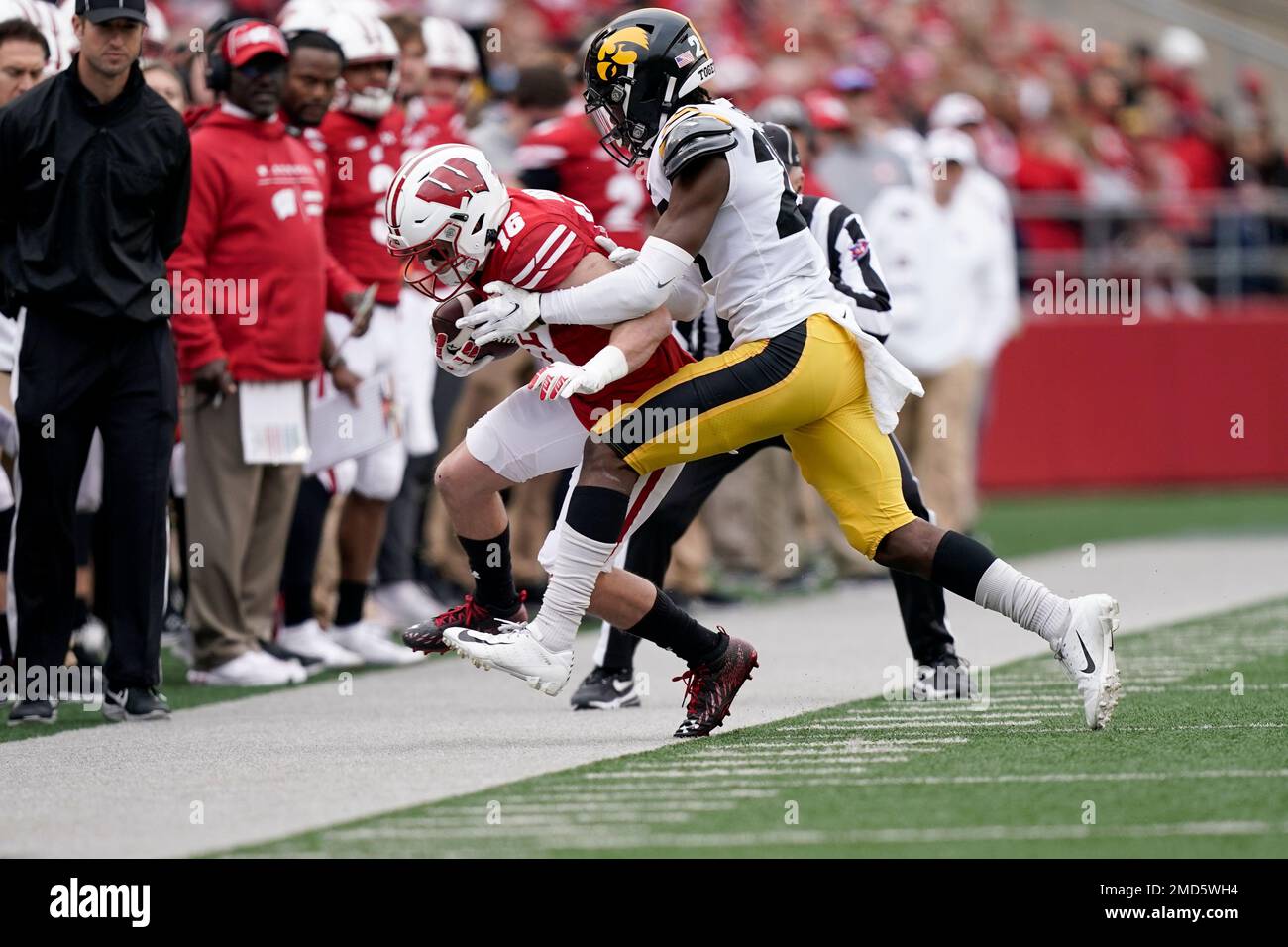 Iowa defensive back Jermari Harris (27) pushes Wisconsin wide receiver ...