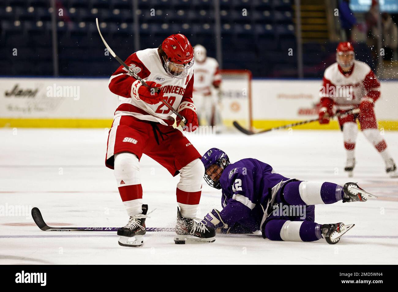 Sacred Heart right wing Todd Goehring (29) controls the puck past ...