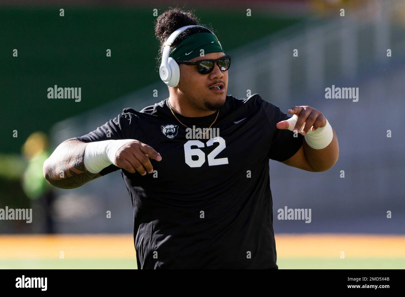 Baylor defensive tackle Siaki Ika (62) warms up before an NCAA college ...