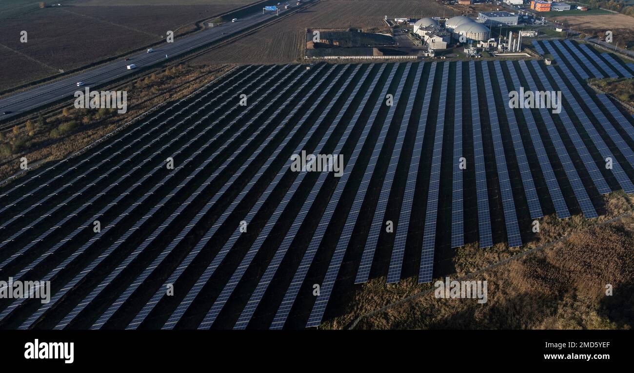 A solar farm, front, and a biogas plant, rear, are seen in Oberkraemer ...