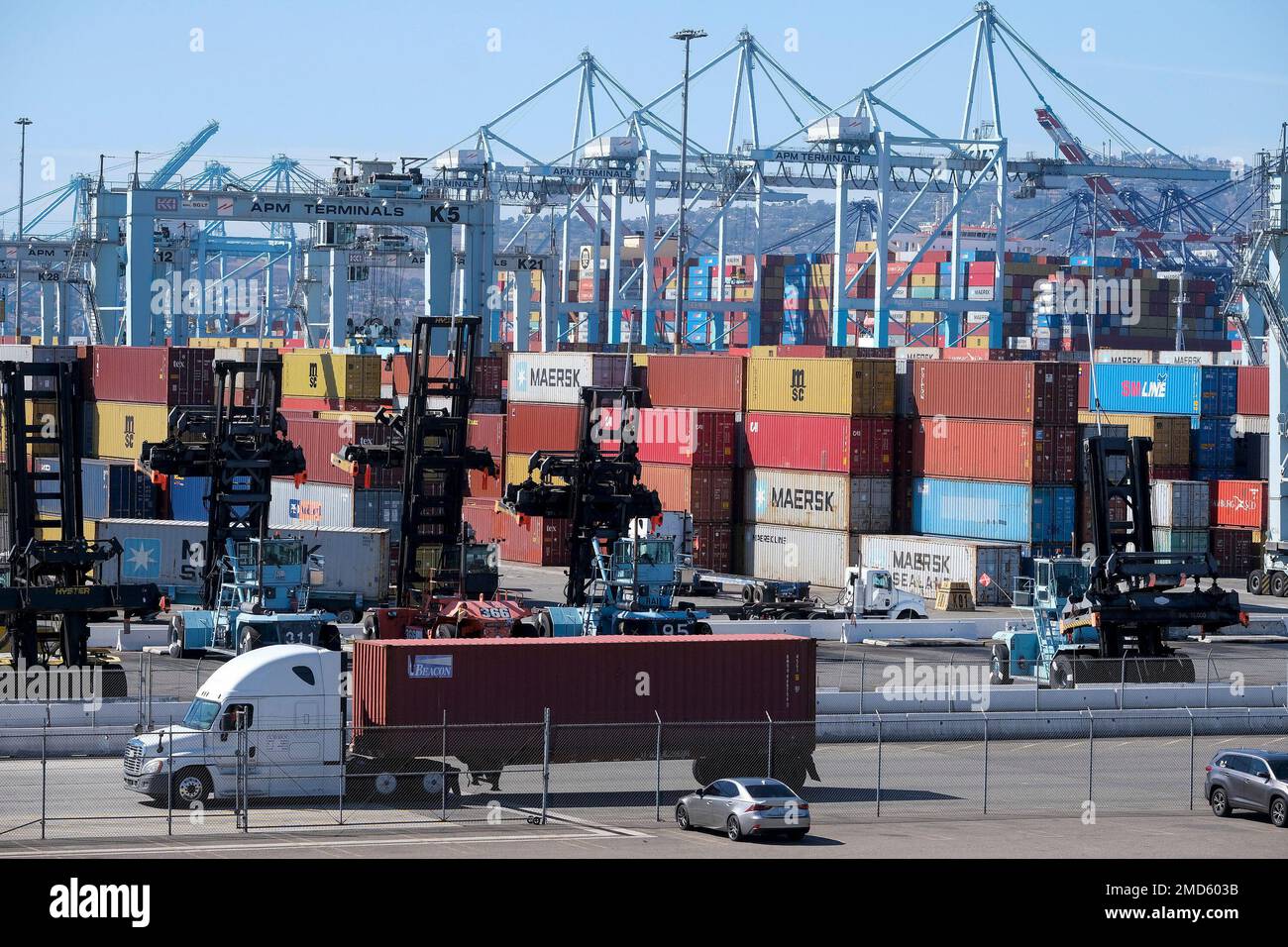 FILE - Cargo containers sit stacked at the Port of Los Angeles ...