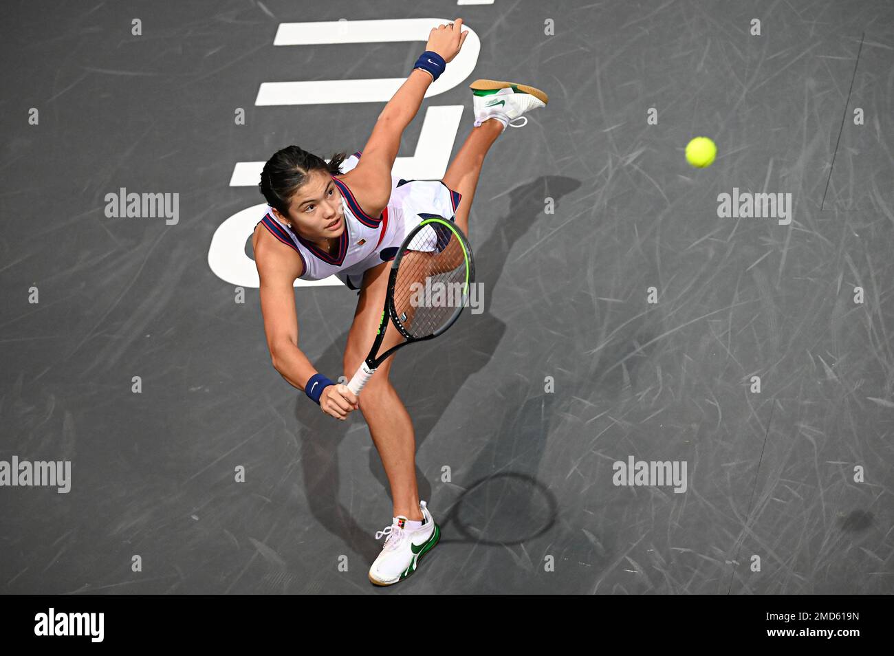 Emma Raducanu, of Britain, returns the ball to Romania's Ana Bogdan at ...