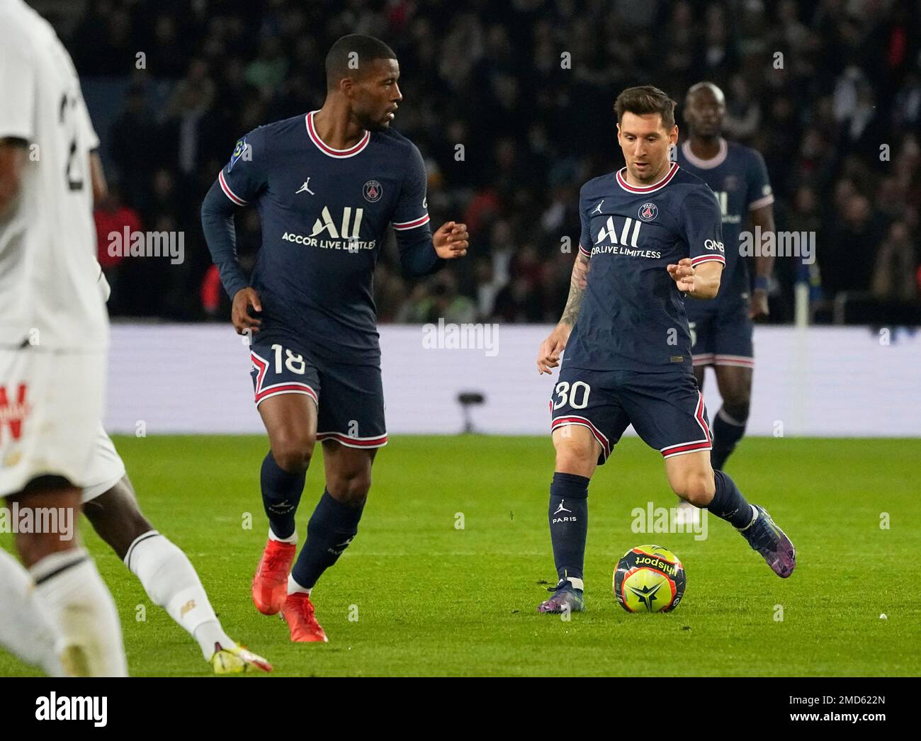 PSG's Lionel Messi, right, and PSG's Georginio Wijnaldum in action ...