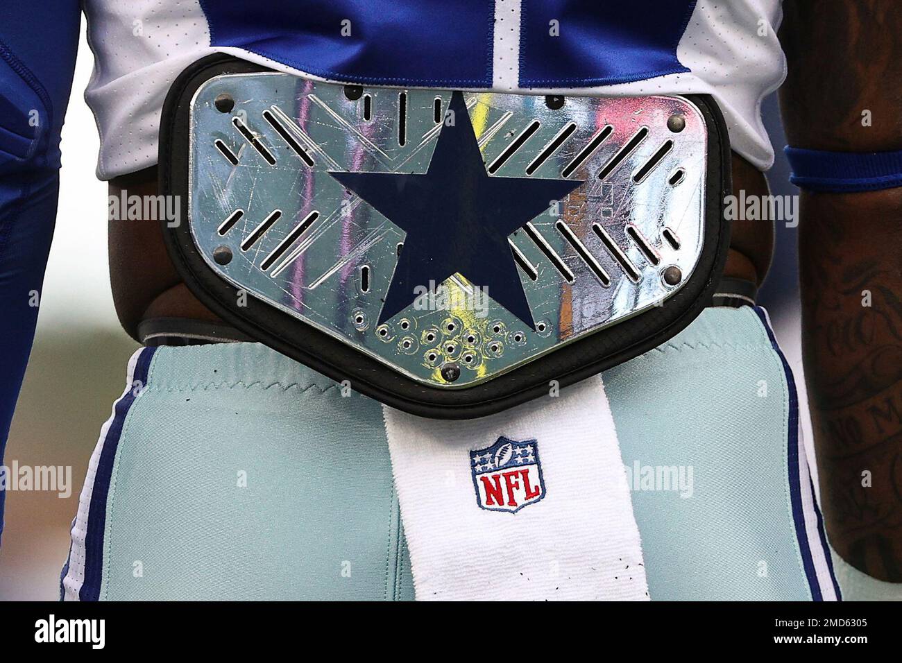The Dallas Cowboys logo is seen on the back of running back Ezekiel ...
