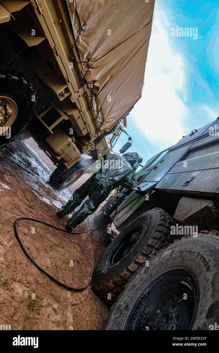 A Finnish soldier assigned to Satakunta Jaeger Battalion decontaminates ...