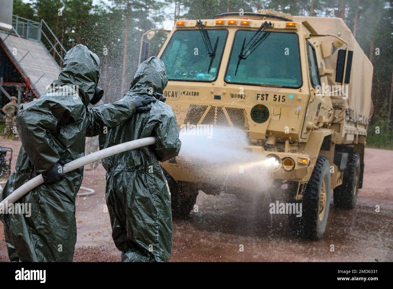 Finnish soldiers assigned to Satakunta Jaeger Battalion decontaminate a ...
