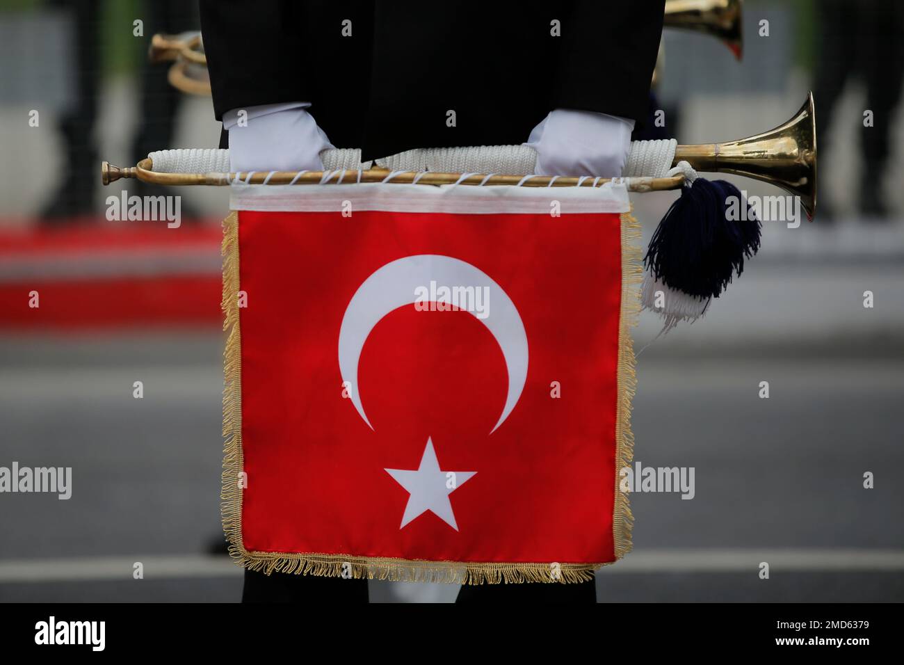 A Turkish soldier holds a trumpet with the Turkish flag as taking part ...