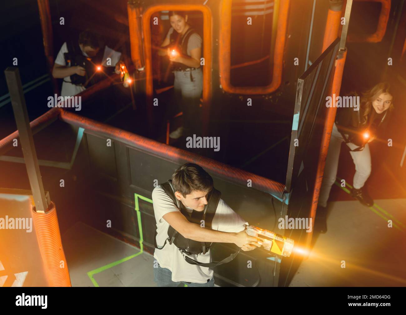 Team of young people play laser tag in labyrinth. View from above Stock ...