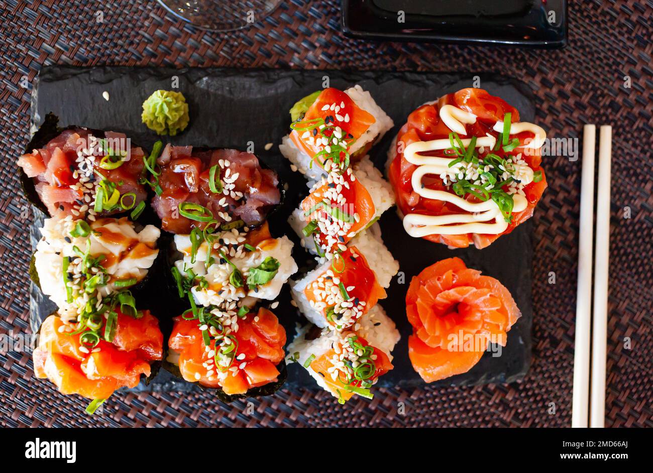 Combined sushi - gunkan, uramaki, sashimi closeup. Japanese cuisine ...