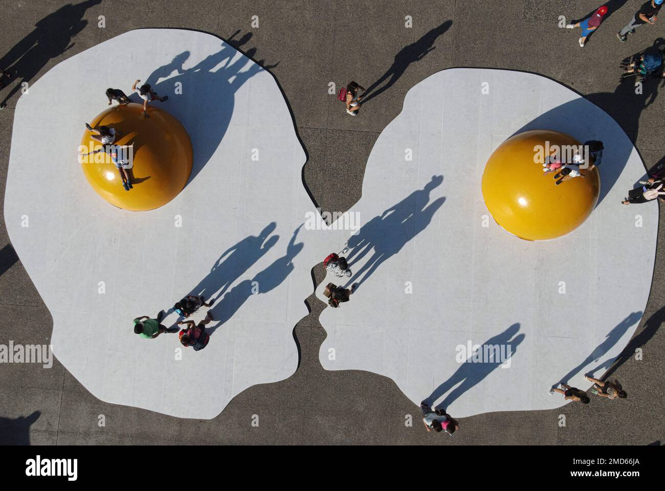 Children play on the "Art Eggcident," urban art installation by the ...