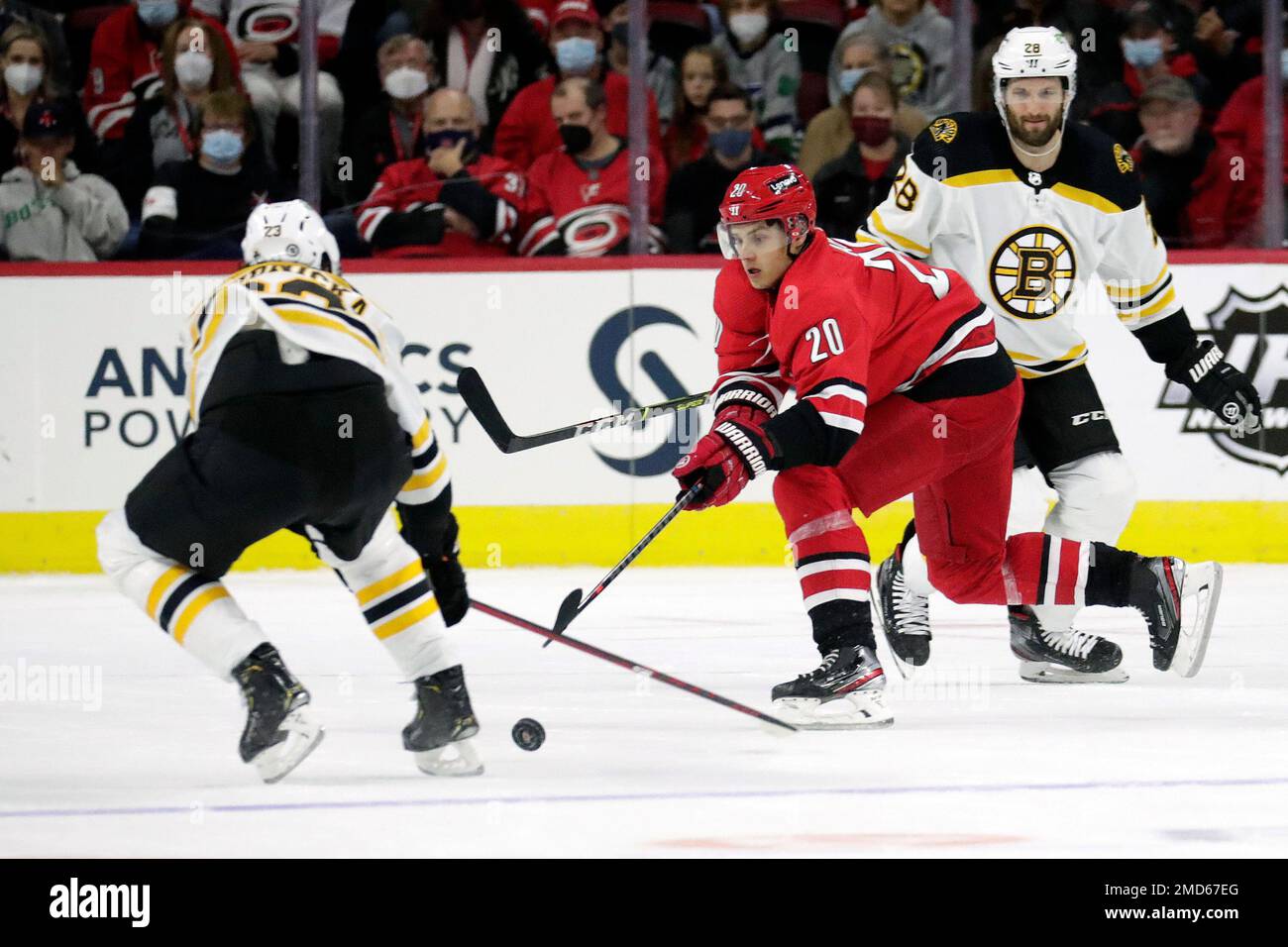Carolina Hurricanes right wing Sebastian Aho (20) battles Boston Bruins ...