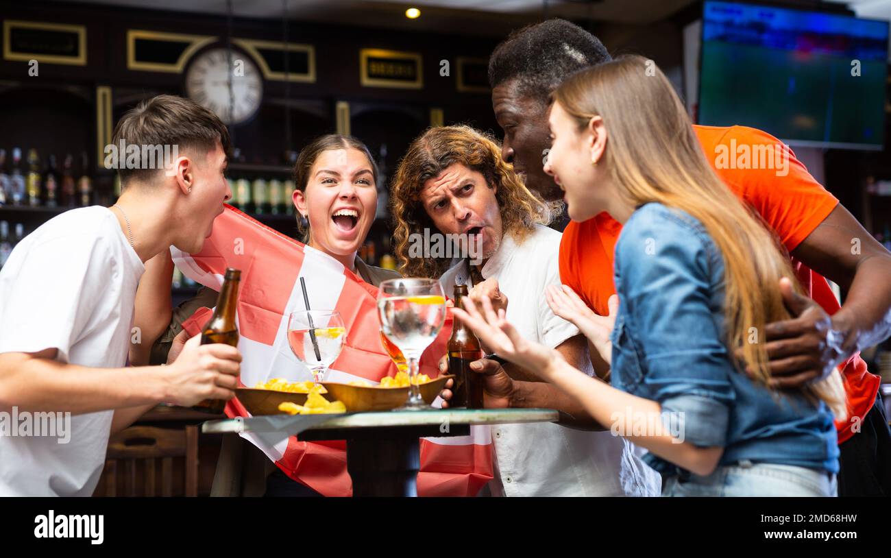 Denmark sports fans supporting their favourite team in pub Stock Photo ...