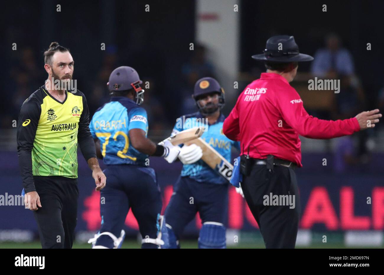 Australia's Glenn Maxwell, left, reacts as umpire signals a boundary in ...