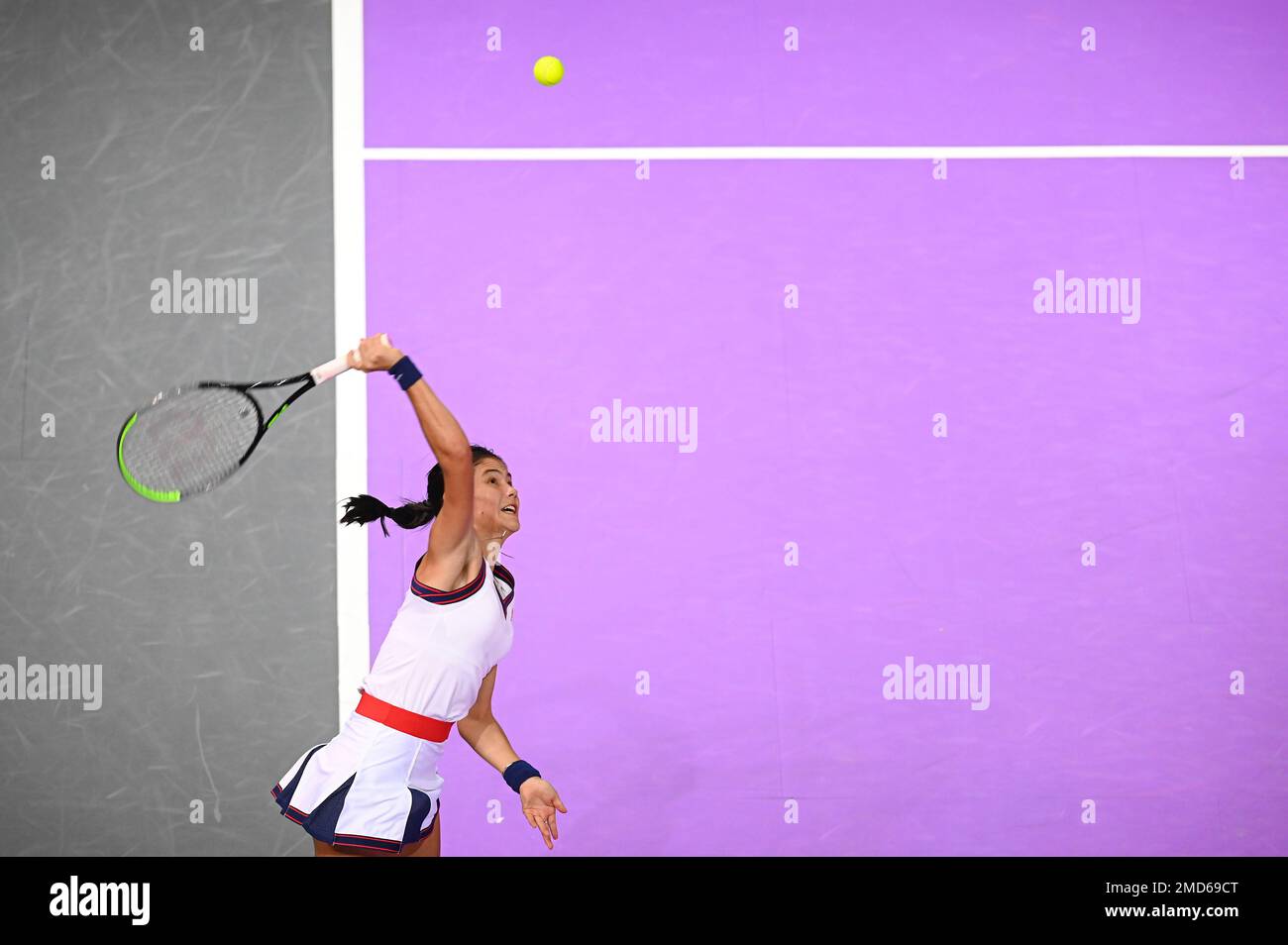 Emma Raducanu, of Britain, serves to Romania's Ana Bogdan at the ...