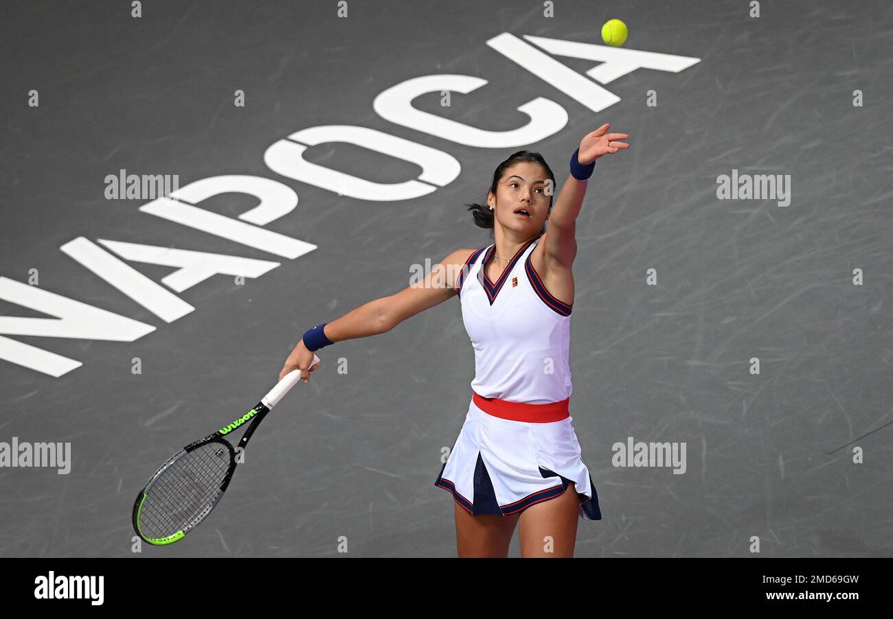 Emma Raducanu, of Britain, serves to Romania's Ana Bogdan at the ...