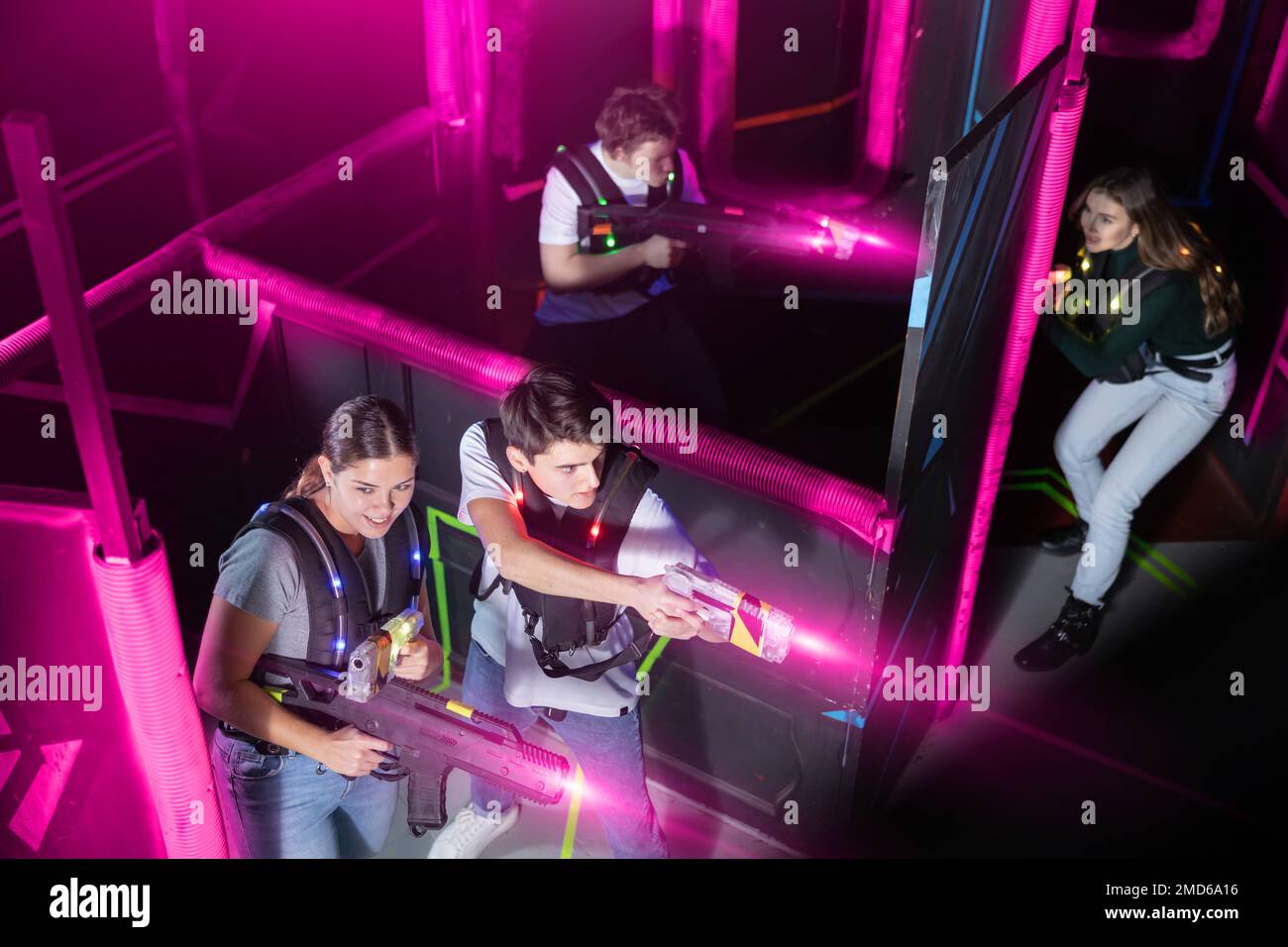 Team of young people play laser tag in labyrinth. View from above Stock Photo - Alamy