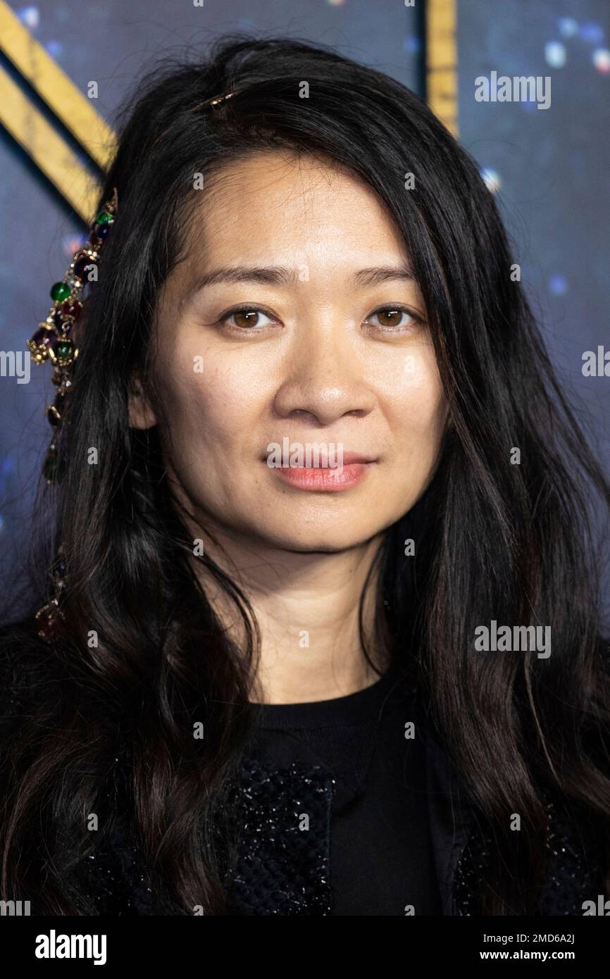 Director Chloe Zhao poses for photographers upon arrival at the ...