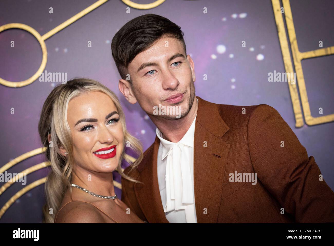 Alyson Sandro, left, and Barry Keoghan pose for photographers upon ...