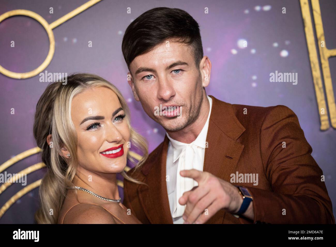 Alyson Sandro, left, and Barry Keoghan pose for photographers upon ...