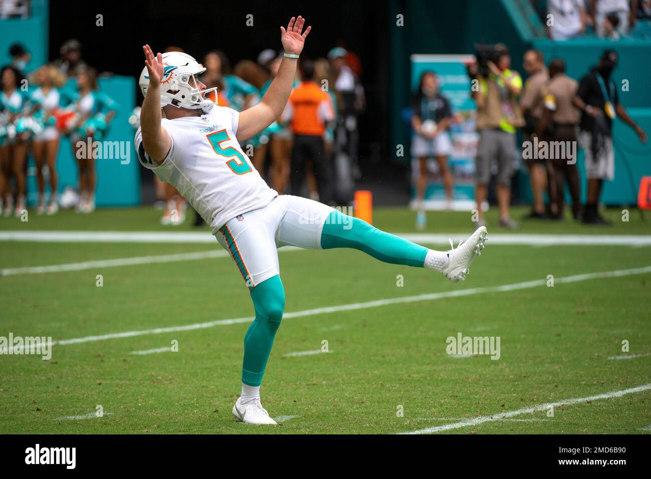 Miami Dolphins punter Michael Palardy (5) punts the ball during an NFL ...