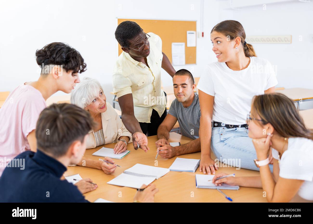 Diverse people on language courses in classroom Stock Photo - Alamy