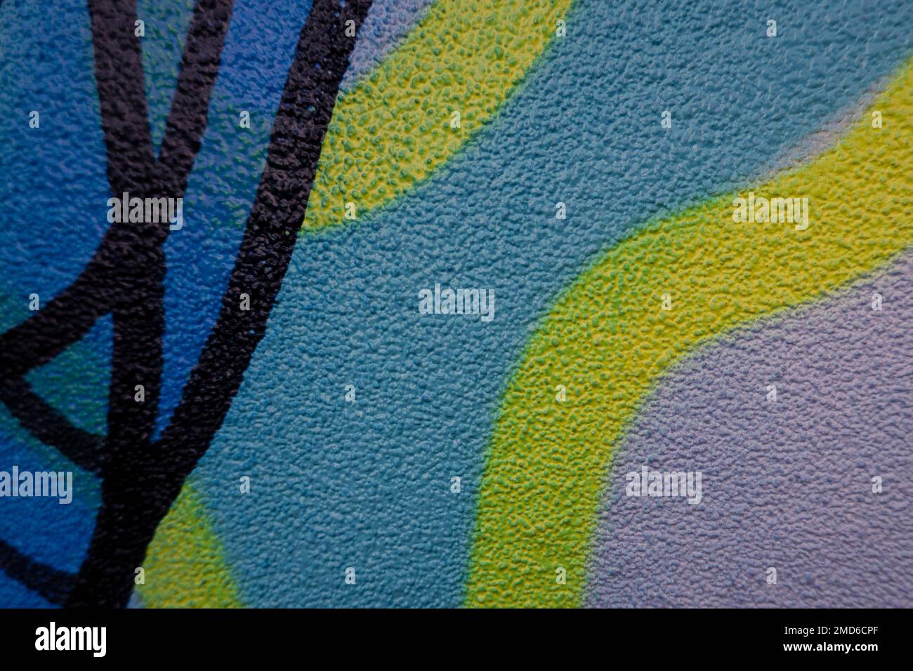 Fragment of the wall with colorful graffiti painting in the street ...