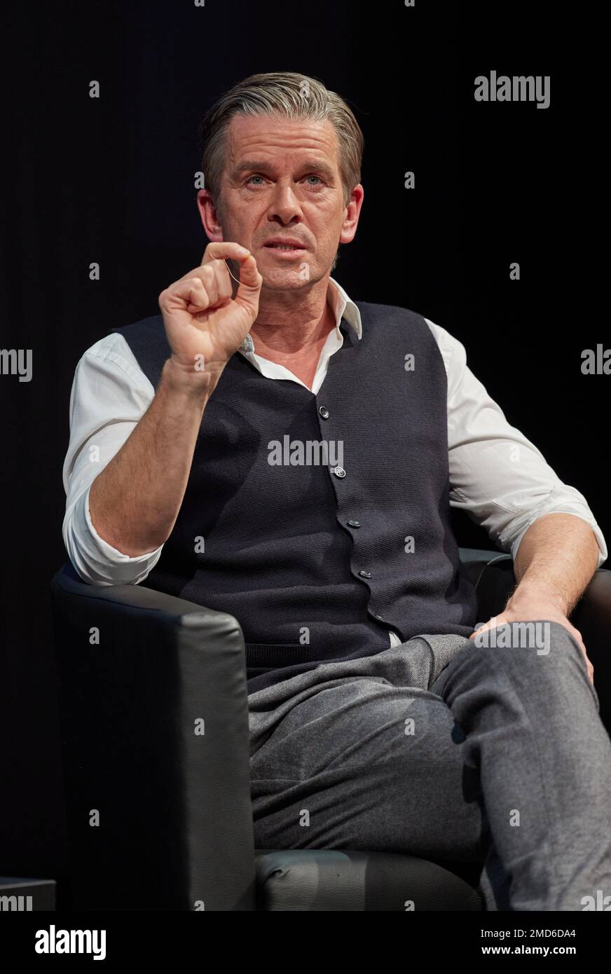 Hamburg, Germany. 22nd Jan, 2023. Markus Lanz, presenter, sits on stage ...