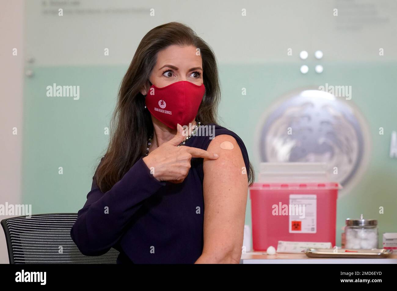 Oakland Mayor Libby Schaaf points to her arm after receiving a Pfizer ...