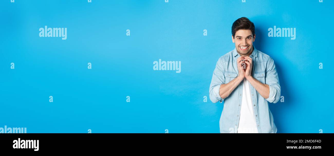 Funny cunning man having evil plan, scheming something and smiling ...