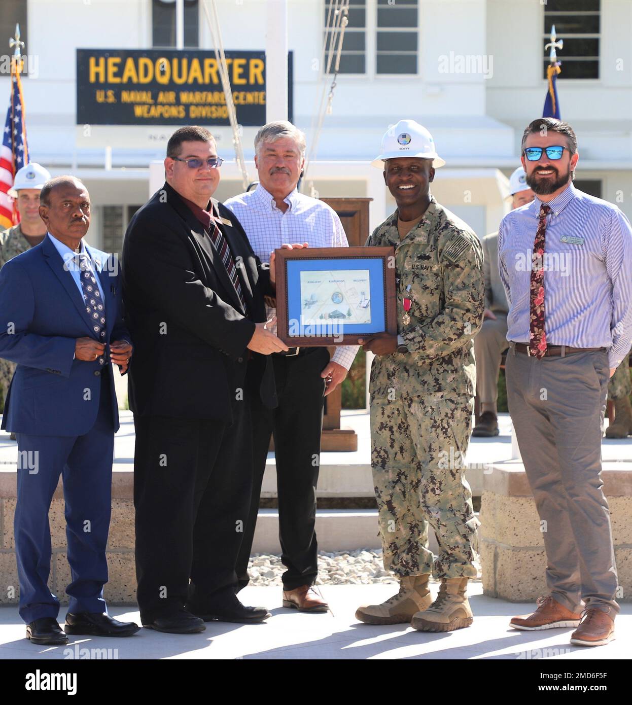 (CHINA LAKE) – Capt. Laurie Scott presenting a token of his ...