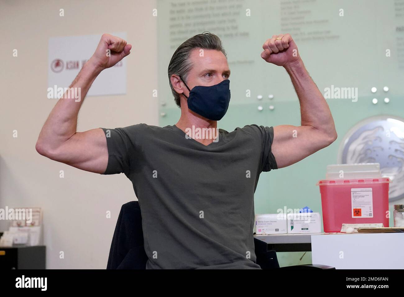 Gov. Gavin Newsom gestures after receiving a Moderna COVID-19 vaccine ...
