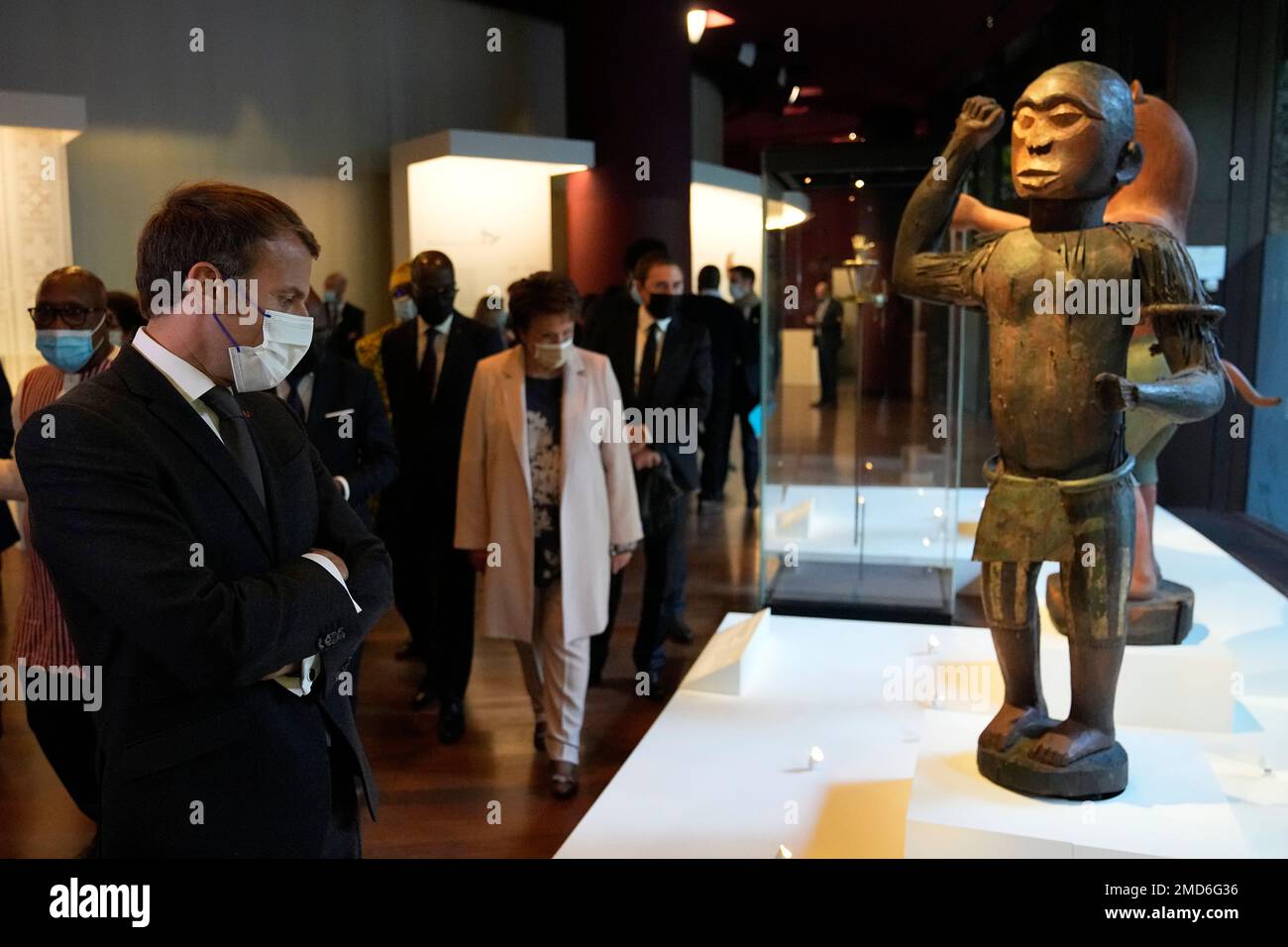 French President Emmanuel Macron, left, watches the 19th century royal ...