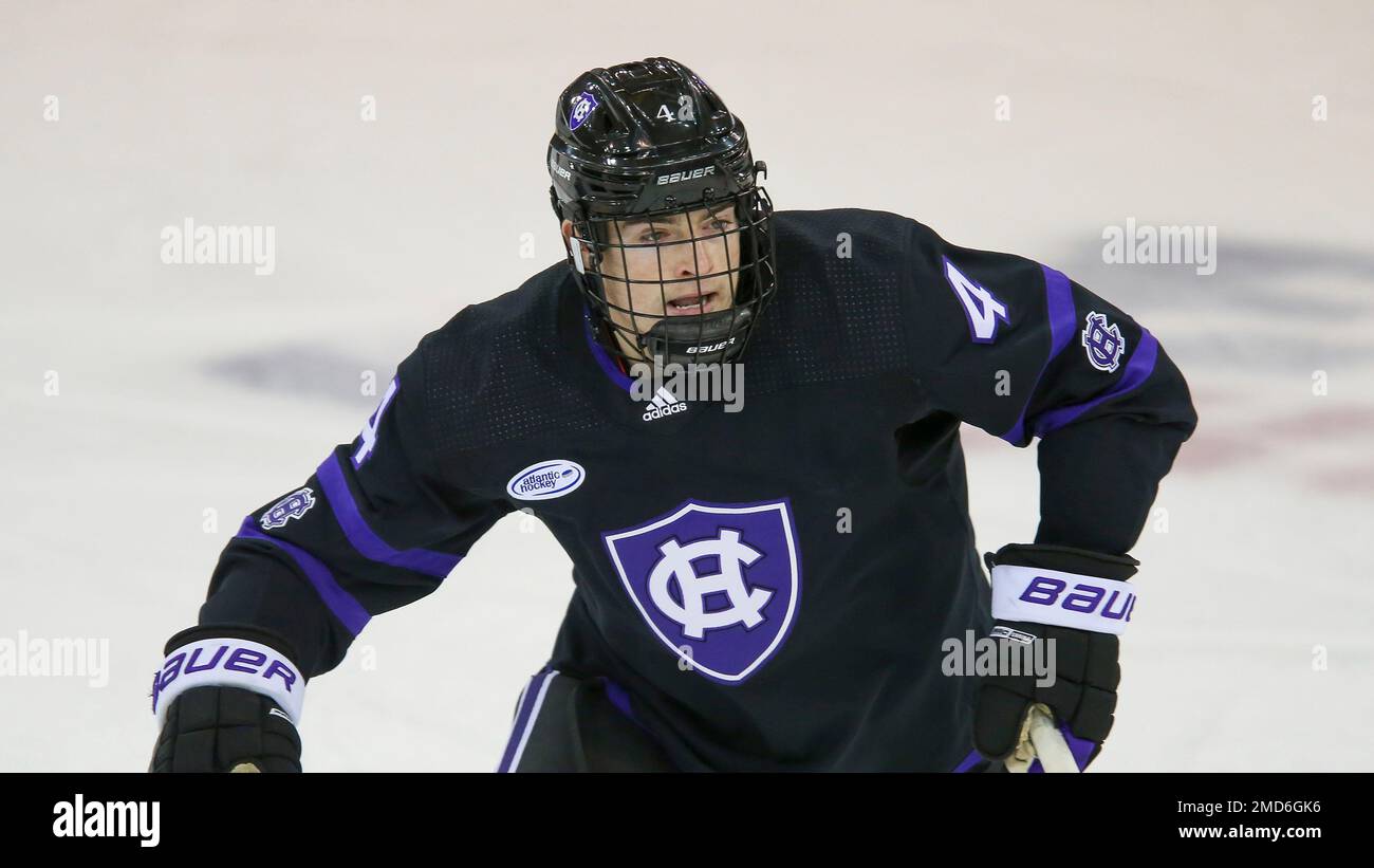 Holy Cross's Jake Higgins (4) skates during the second period of an ...