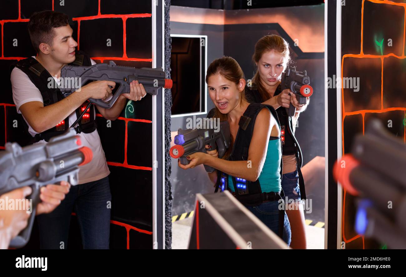 Nice Laser tag players playing in teams Stock Photo - Alamy