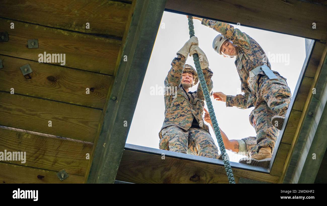 Sam Mercurio (left), a midshipman at Villanova University, receives ...