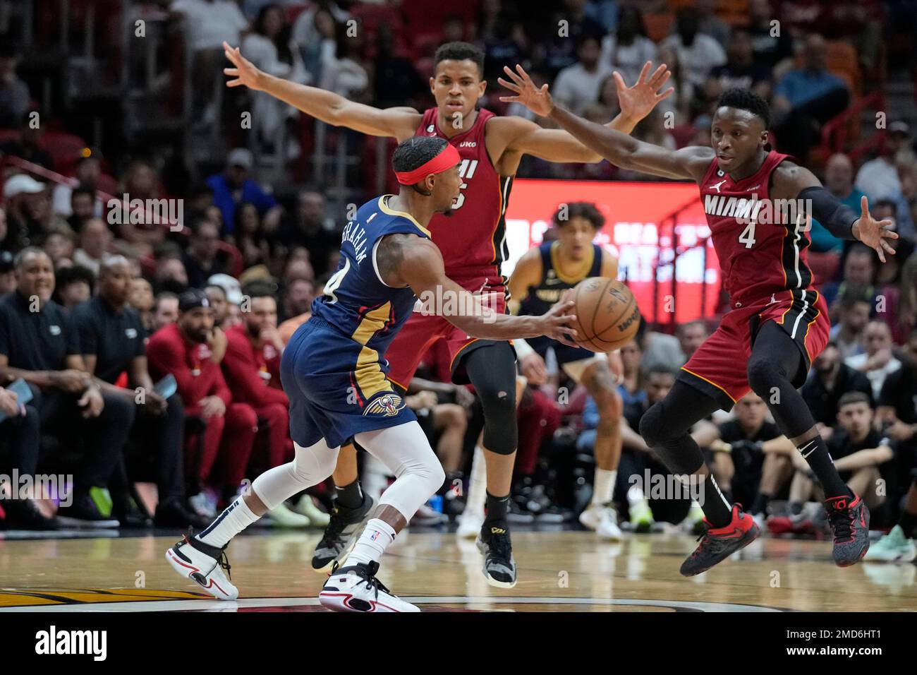 New Orleans Pelicans guard Devonte' Graham, foreground, passes past ...