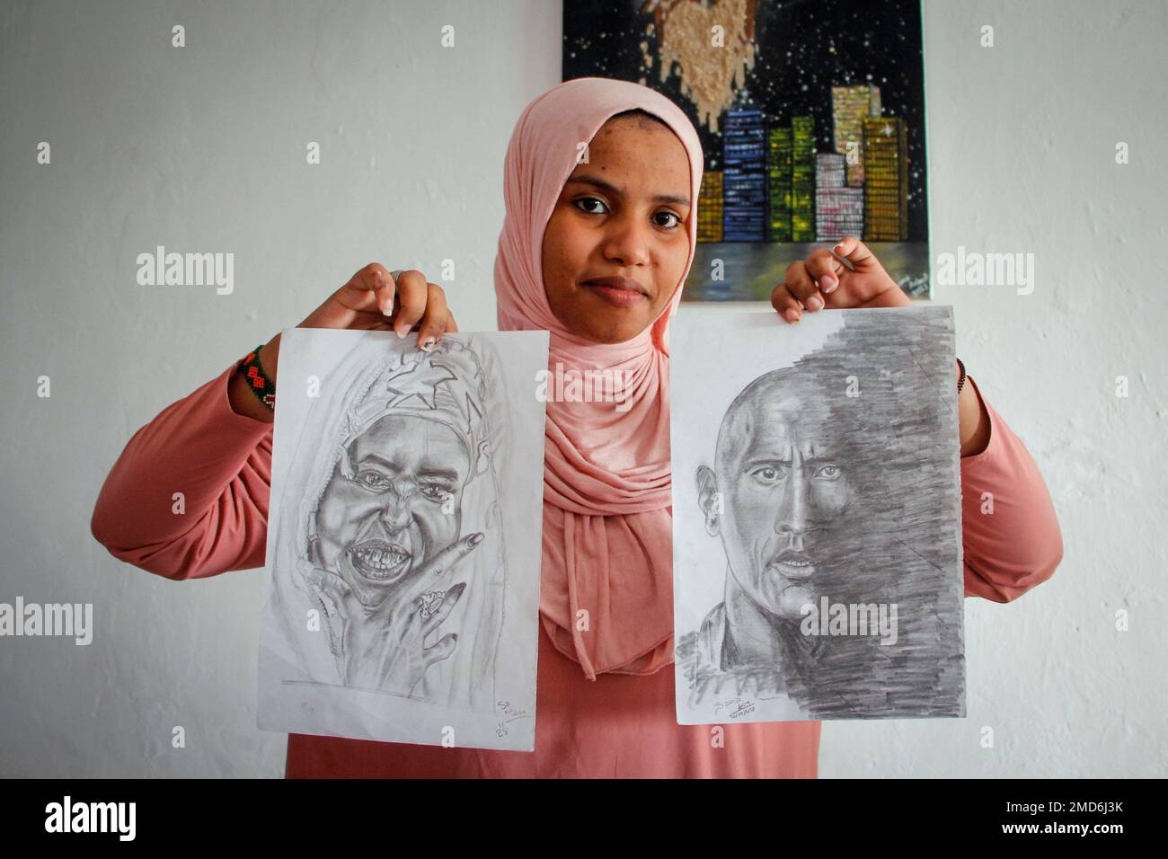 Somali artist Sana Ashraf Sharif Muhsin, 21, displays some of her ...
