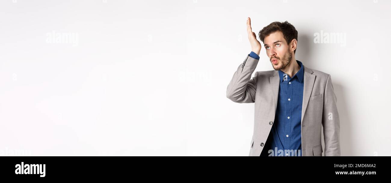 Man shocked with someone very stupid. Annoyed businessman roll eyes and ...