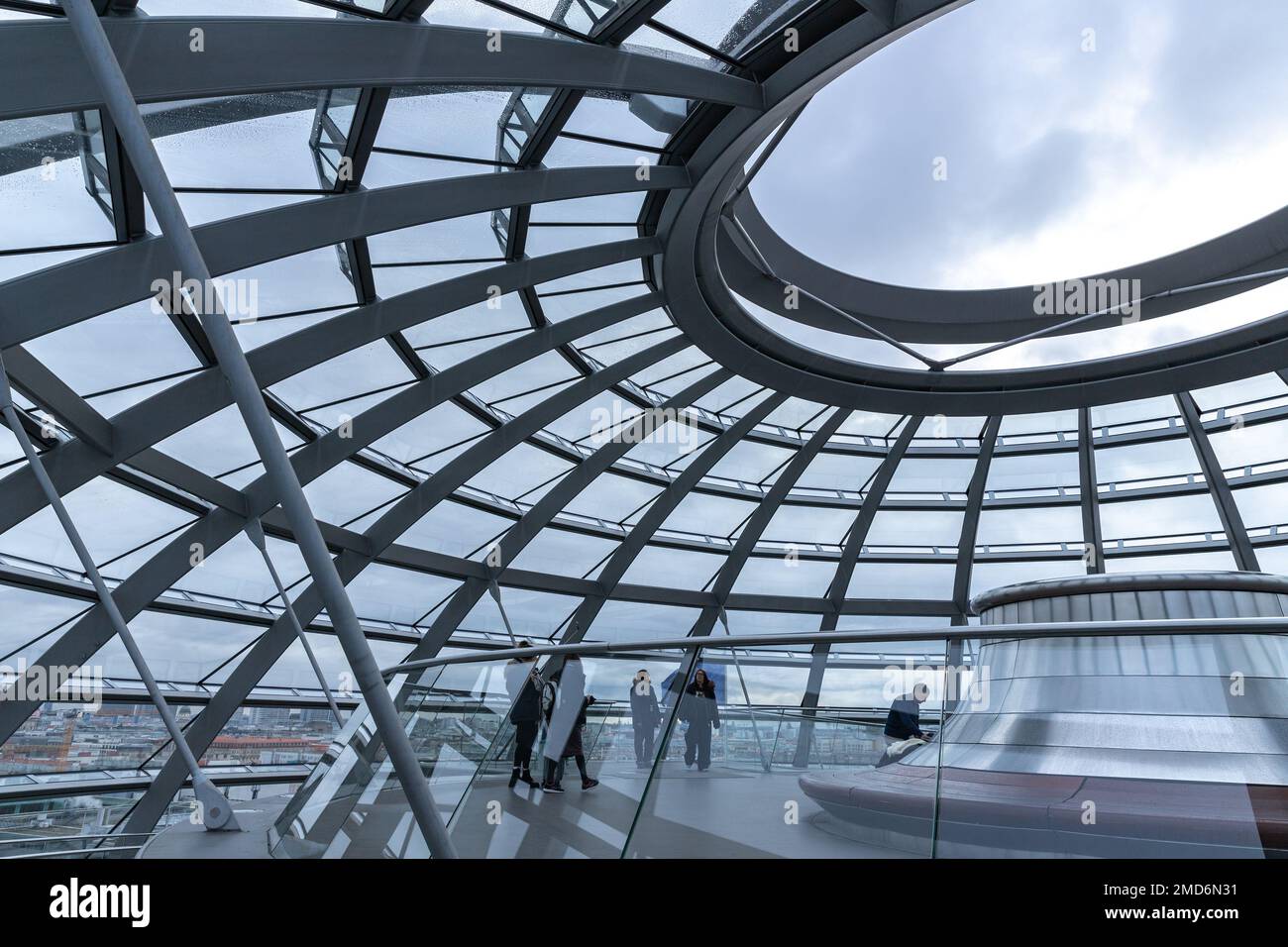 Inside the Bundestag dome. Tourists visit the parliament building of ...